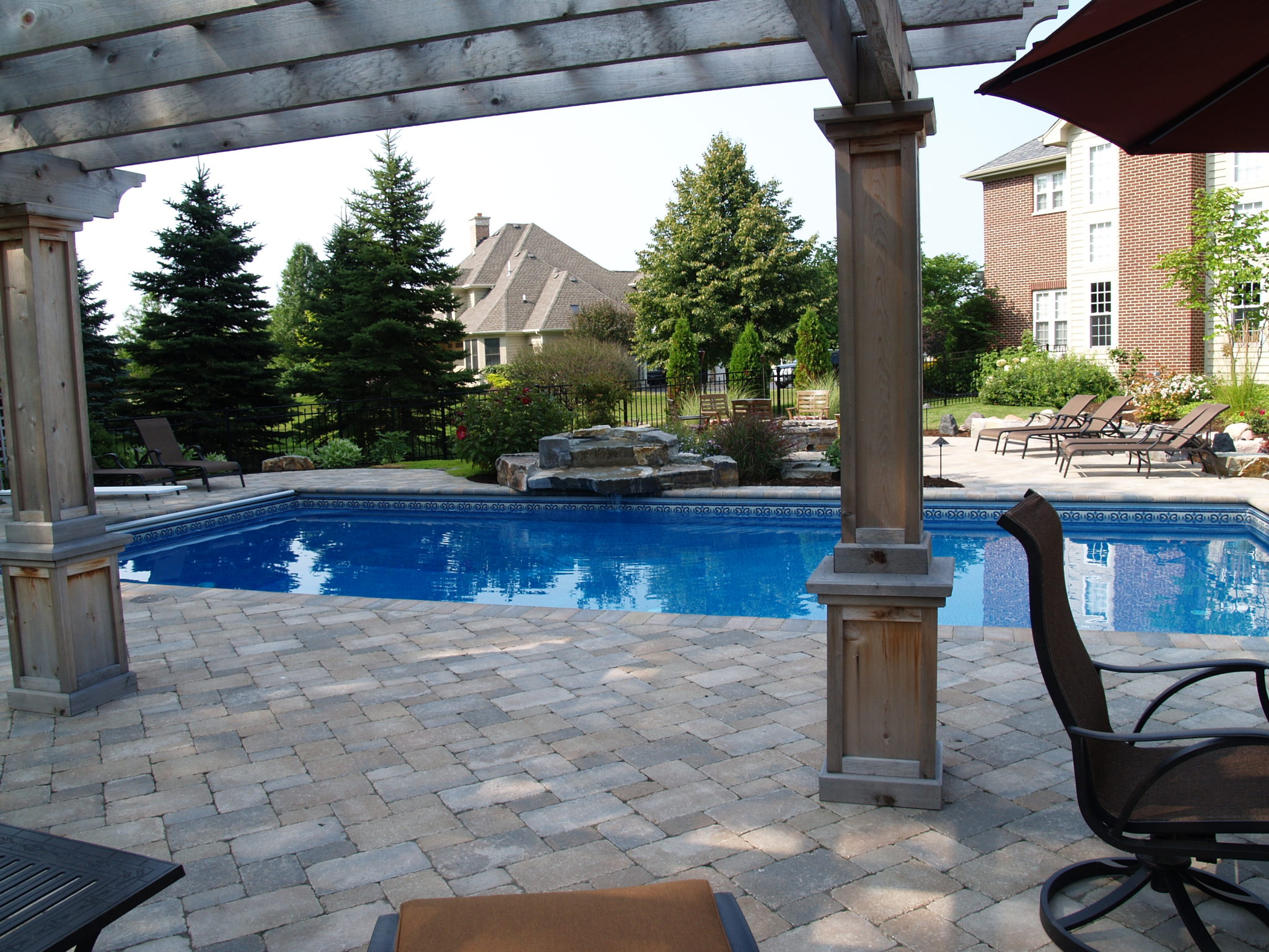 Custom Stone Tile lends beauty to this pool design. (16) - Arvidson ...