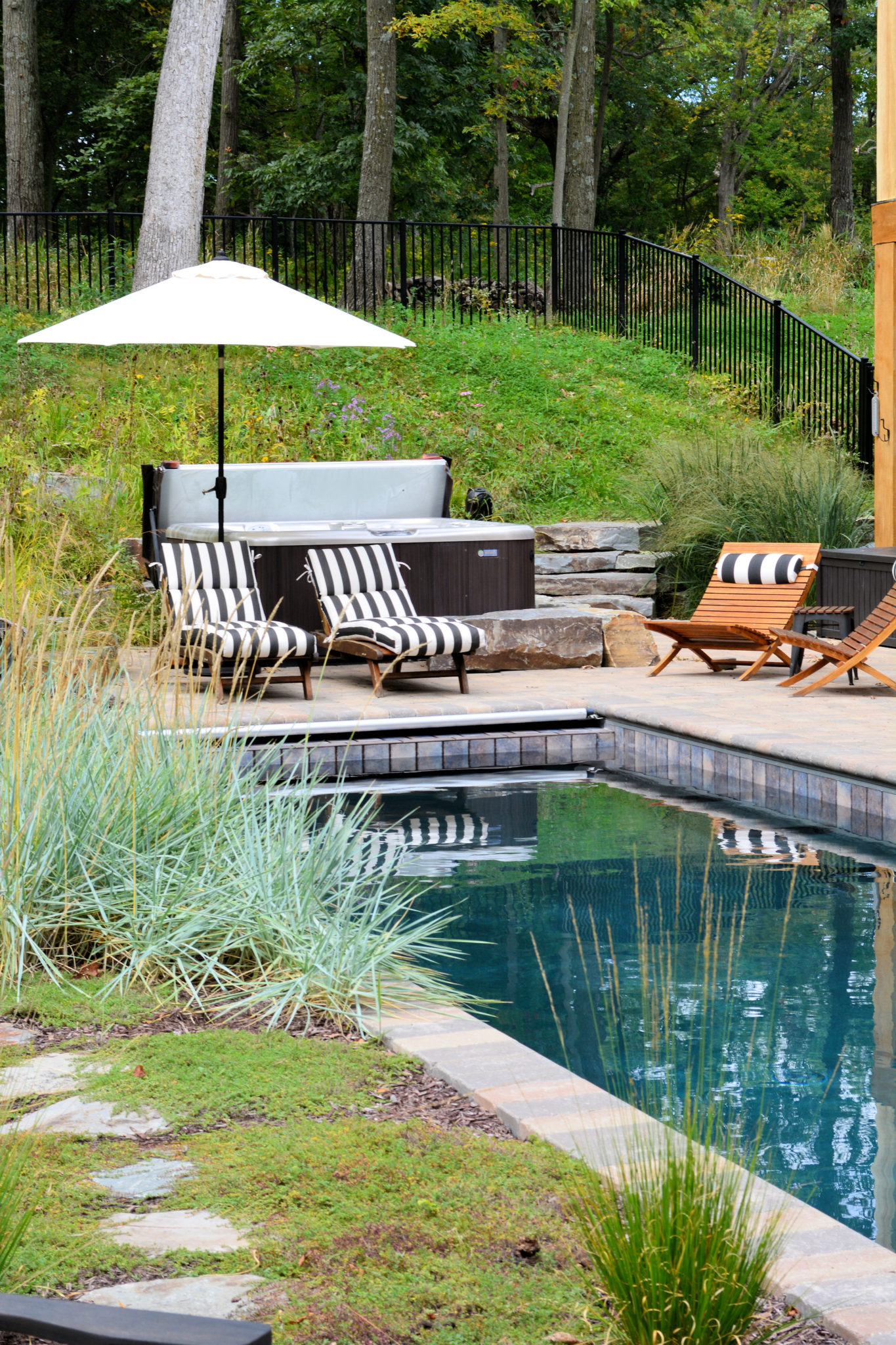 Placement of a HotSpring spa complements this custom pool design. (24 ...