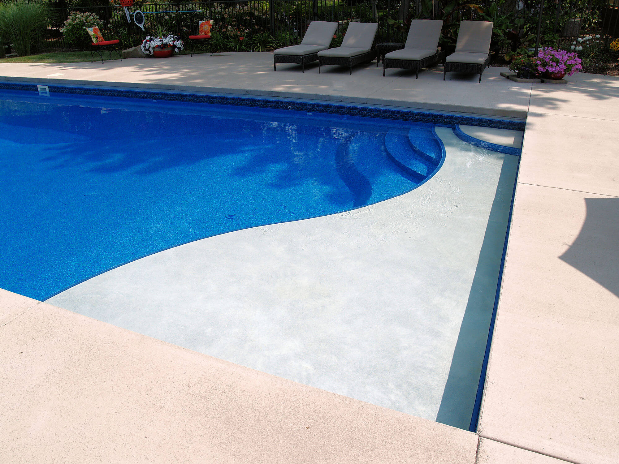 A large swim platform gives a pool versatility - it's a place to bask ...