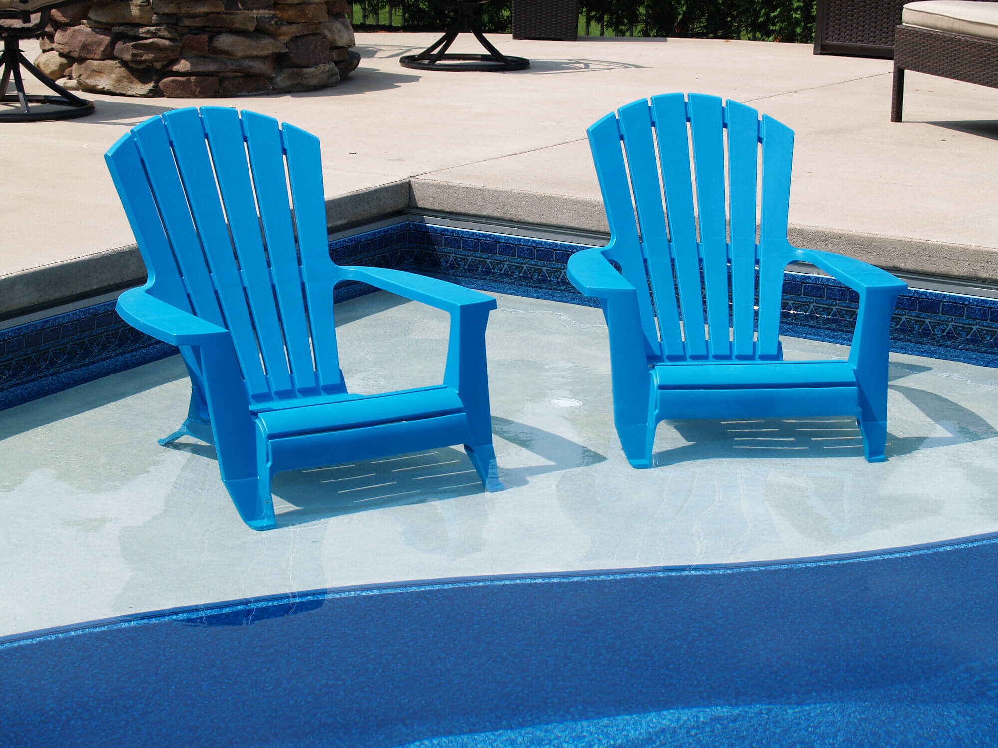 Relax on a custom swim platform. (40) - Arvidson Pools and Spas