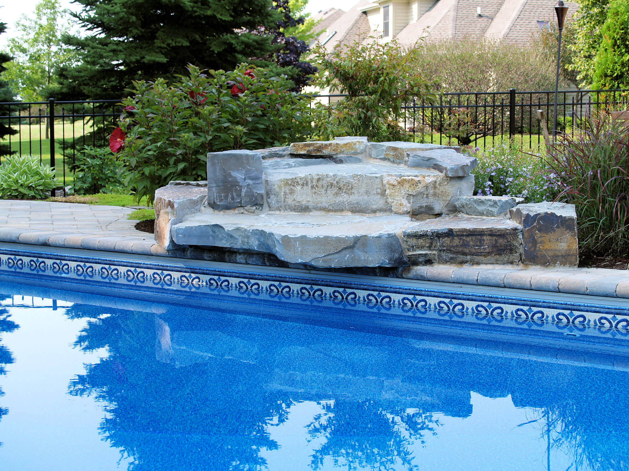 Well placed rocks add a pleasing design element. (78) - Arvidson Pools ...