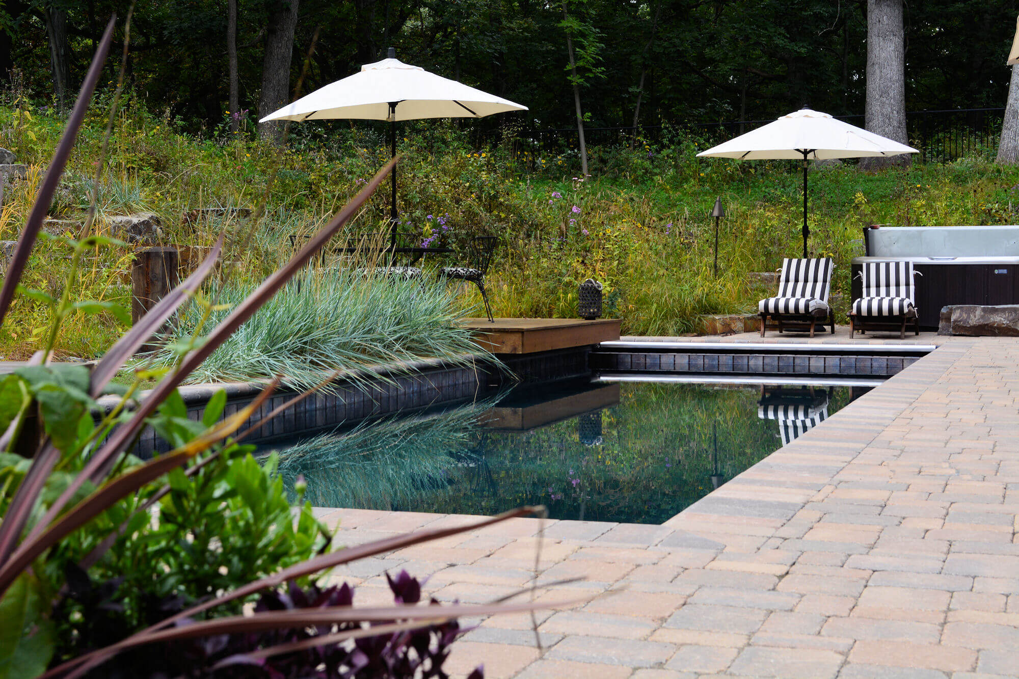Deeper hued liners can create the look to match this natural pool ...