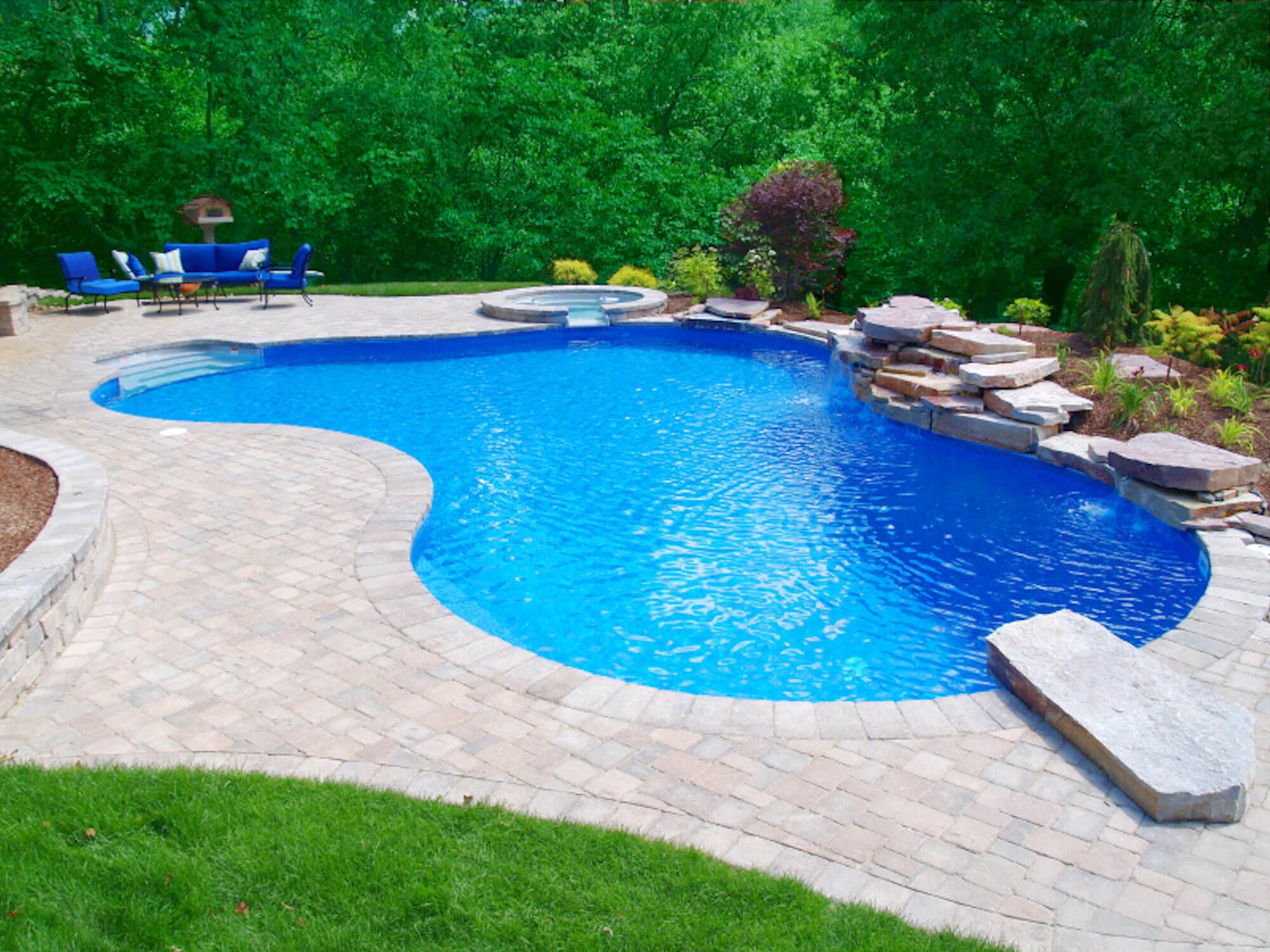 Rock outcroppings add interest to this custom pool design. (95 ...