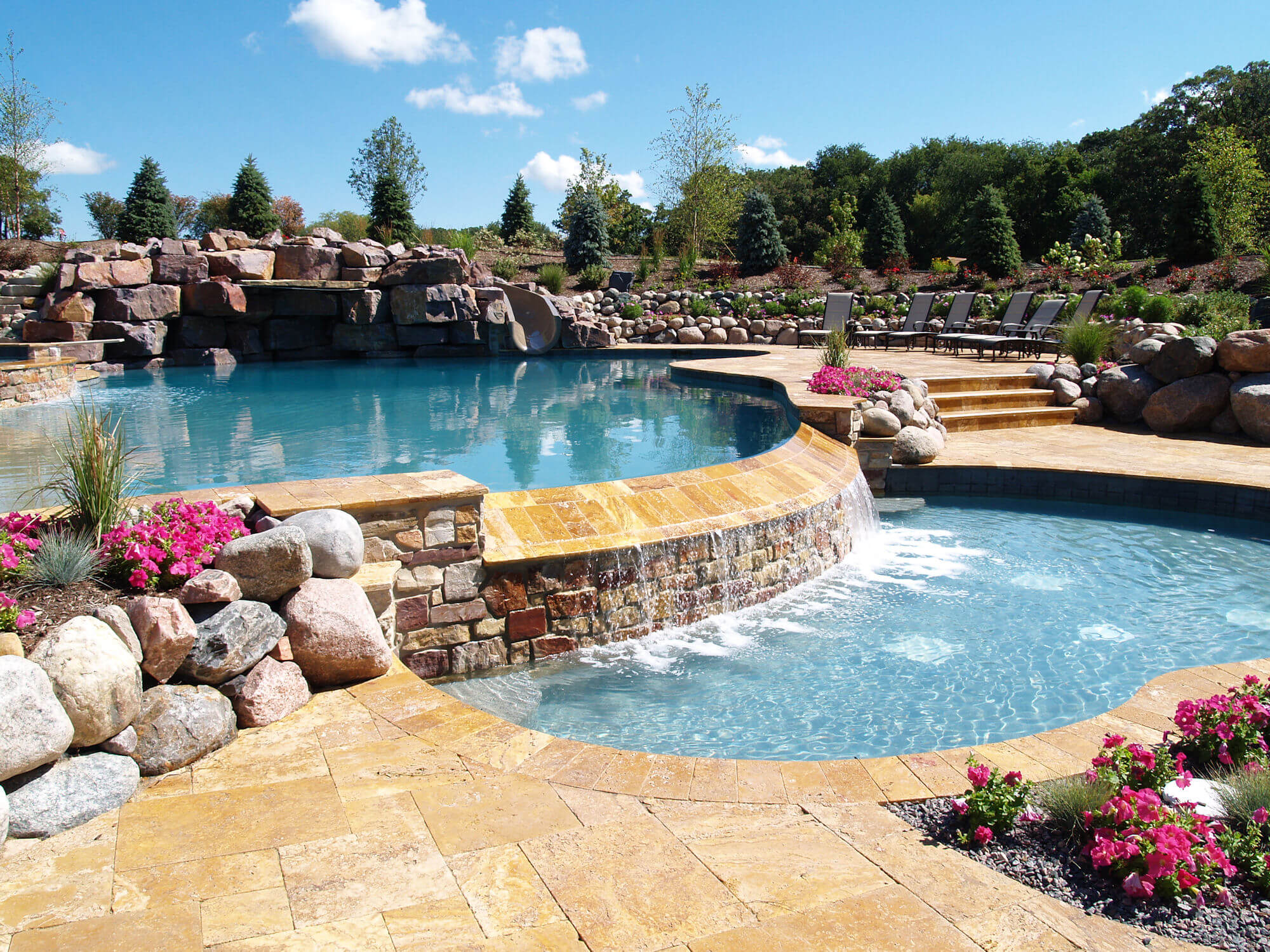 Landscaping, rockscapes, multi-levels, a slide, crystal clear water ...
