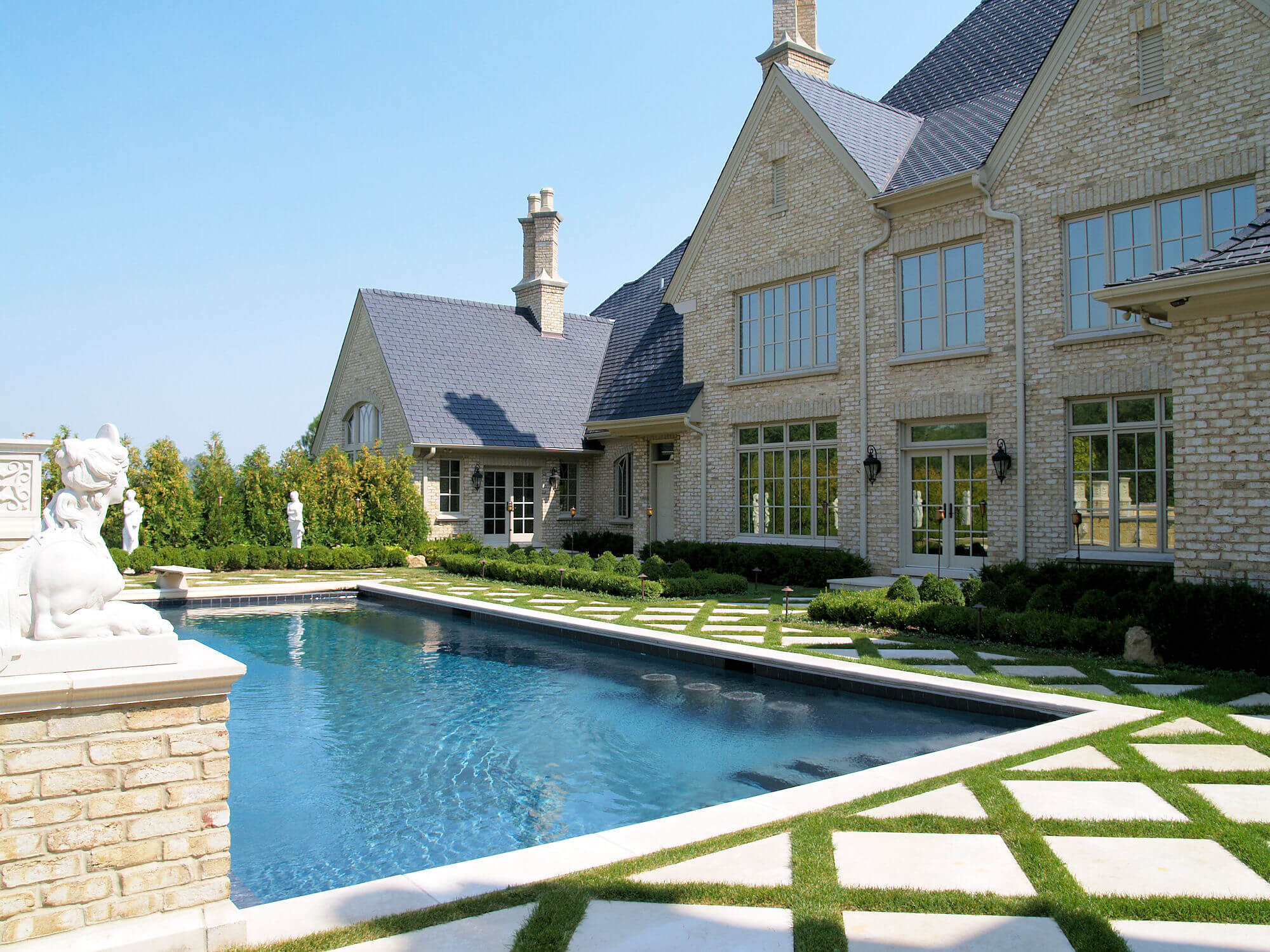 Statuary, geometric landscaping, and elegant fountains create a ...